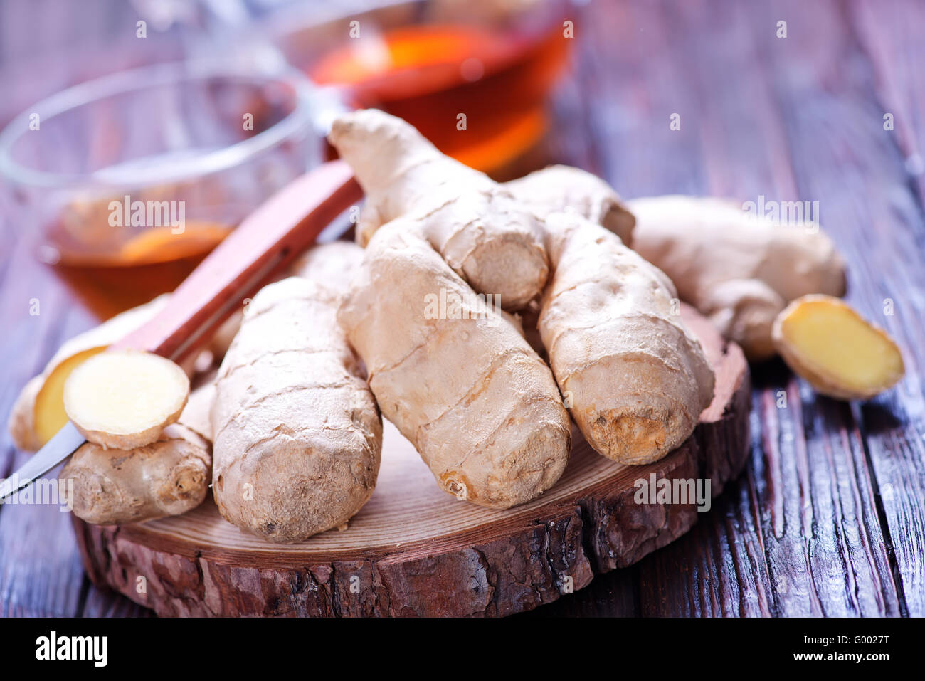 ginger tea with fresh ginger on a table Stock Photo - Alamy