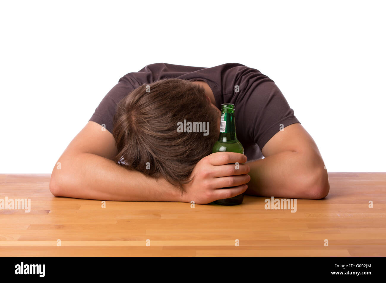 Man sleeping on a table with beer Stock Photo - Alamy