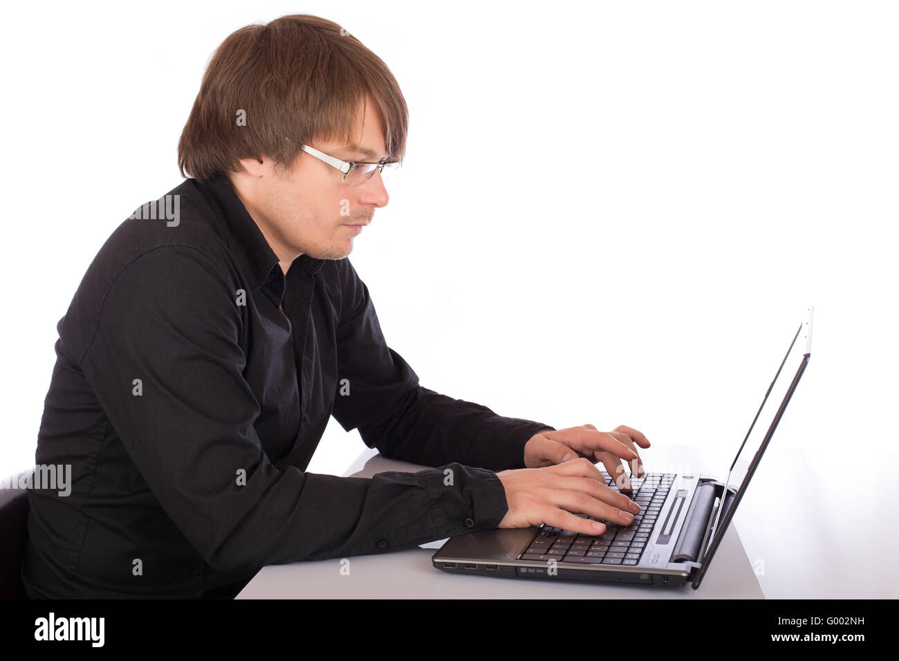 Man working on a laptop Stock Photo - Alamy