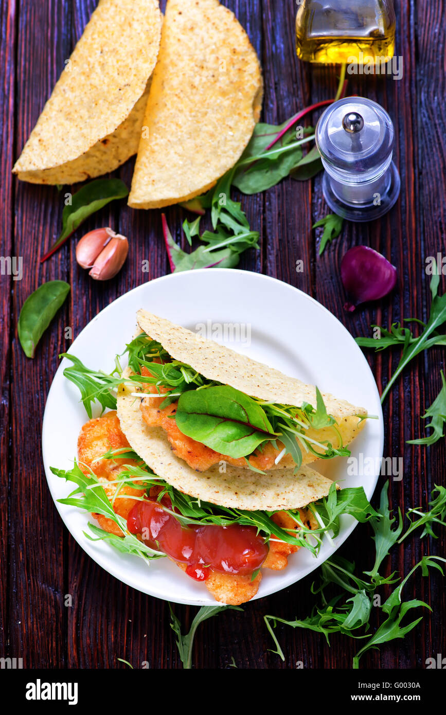 taco with chicken and vegetables on a table Stock Photo - Alamy