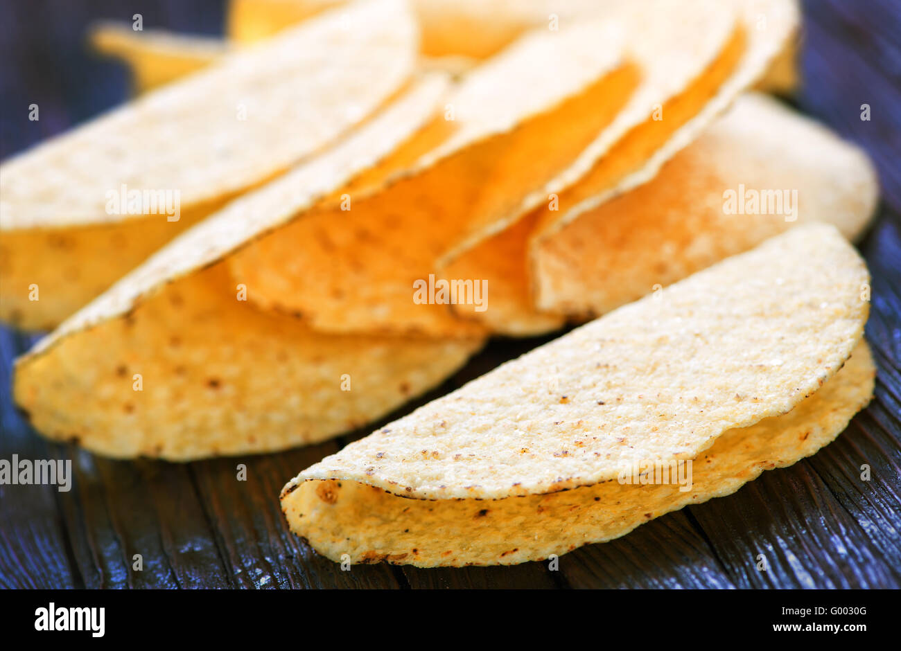 taco shells on the wooden table, mexikan taco shells Stock Photo - Alamy