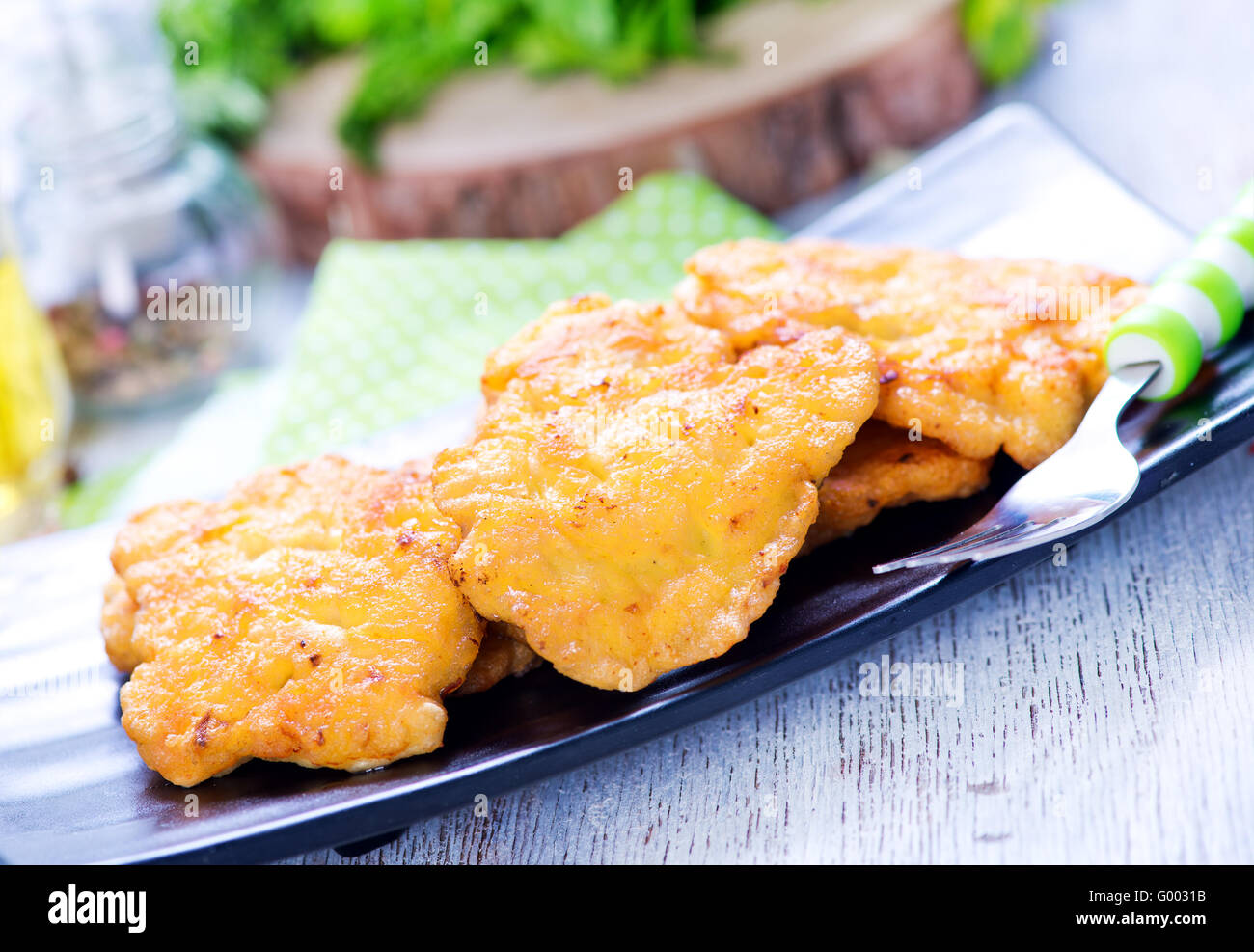 fried chicken cutlets on plate and on a table Stock Photo - Alamy