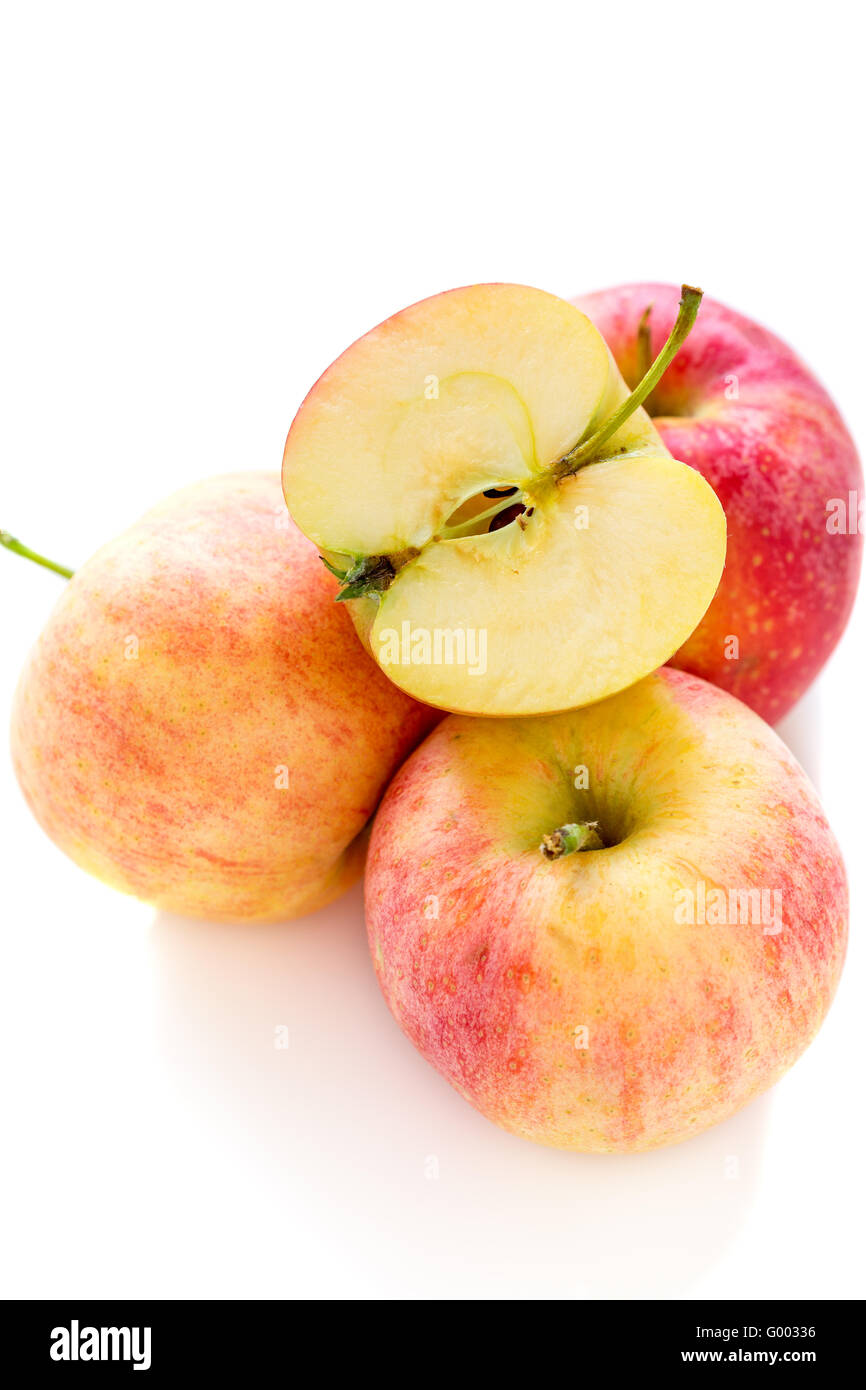 Three whole and half an apple Stock Photo - Alamy