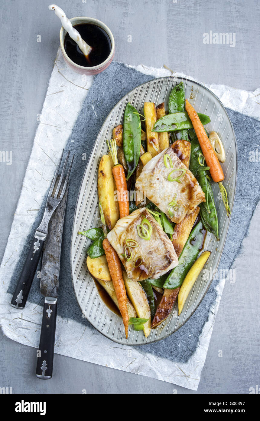 Coalfish Filet with Vegetable Stock Photo - Alamy