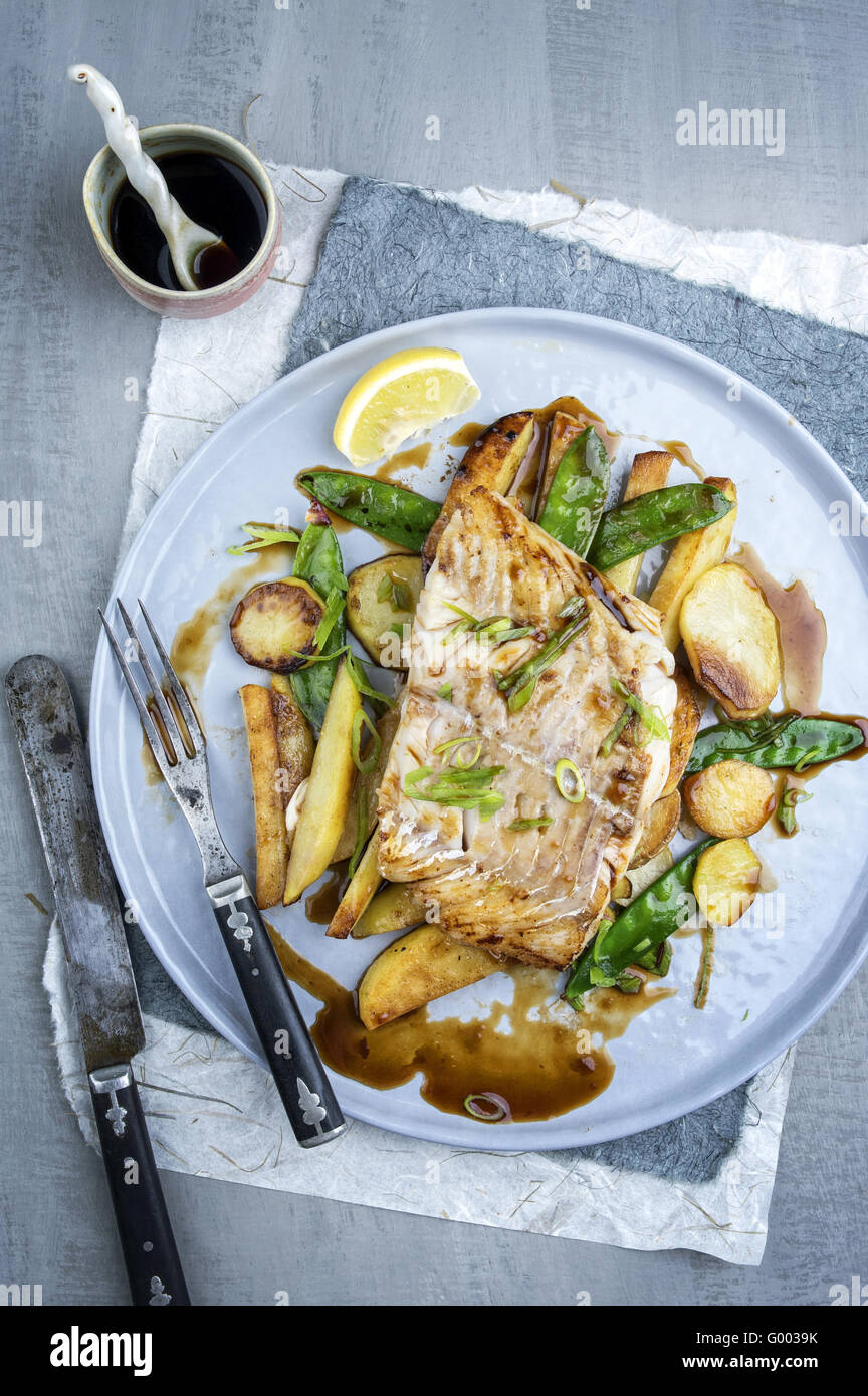 Coalfish Filet with Vegetable Stock Photo - Alamy
