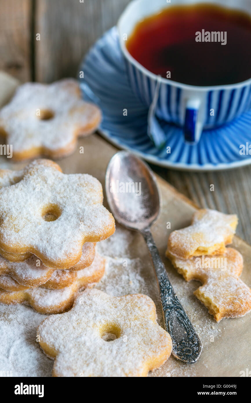 Italian cookies, spoon and a cup of tea Stock Photo - Alamy