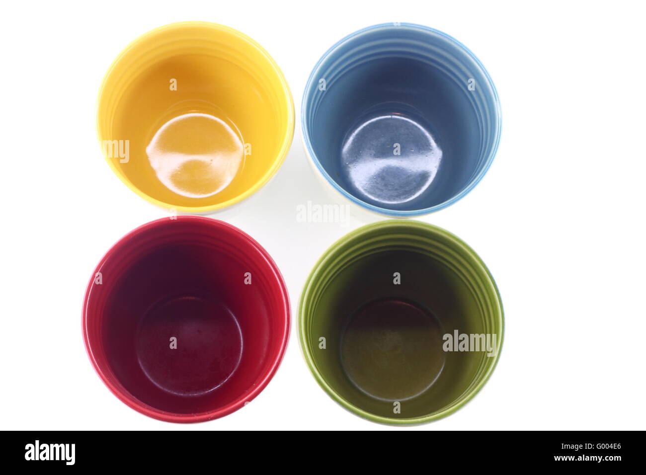 Four tea cups on the white background Stock Photo - Alamy