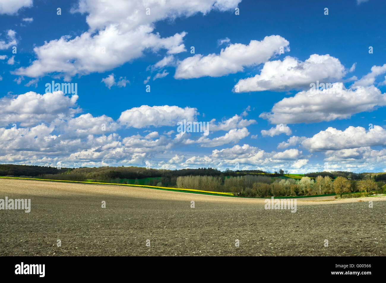 Summer rain clouds across fallow farmland - France Stock Photo - Alamy
