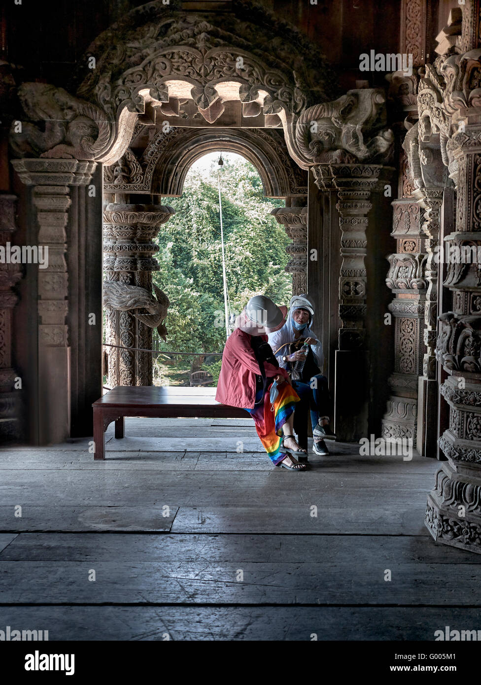 Interior of the Sanctuary of Truth temple with two female tourists ...