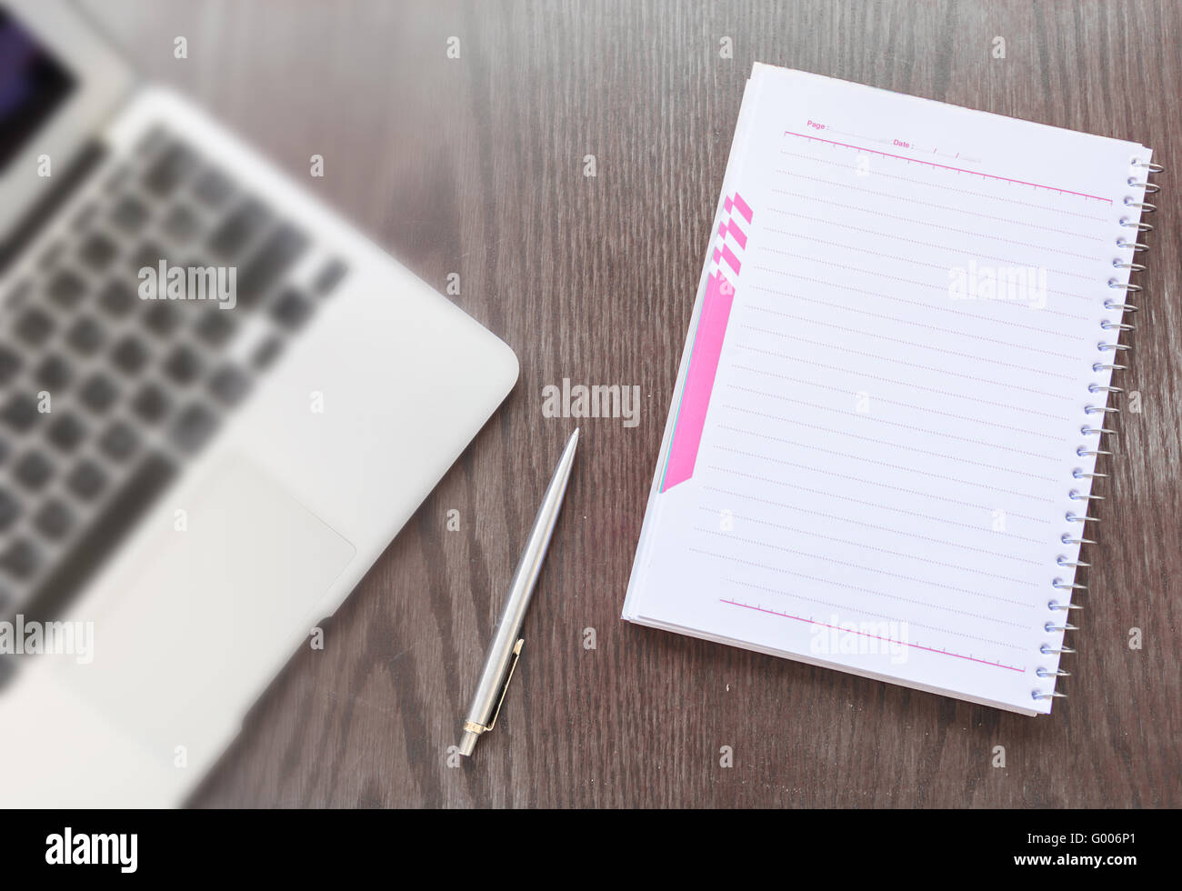 Notepad, pen and laptop on old wooden desk Stock Photo - Alamy