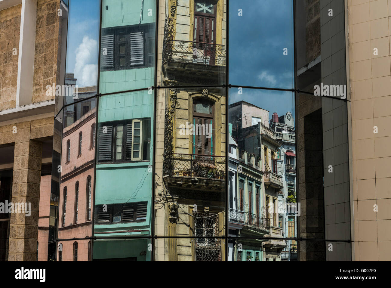 The mirrored windows of the "Museo Belles Artes" reflect three distinct ...