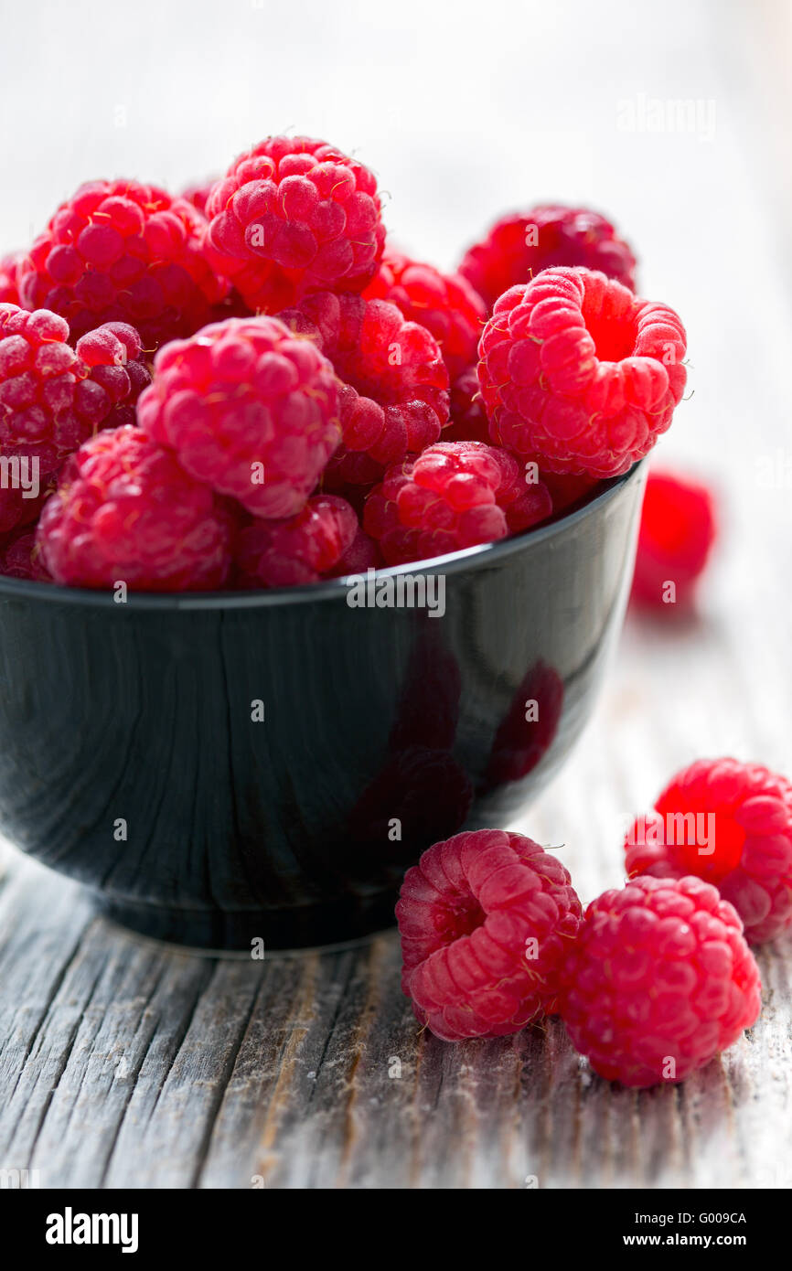 Ripe raspberries in a bowl Stock Photo - Alamy