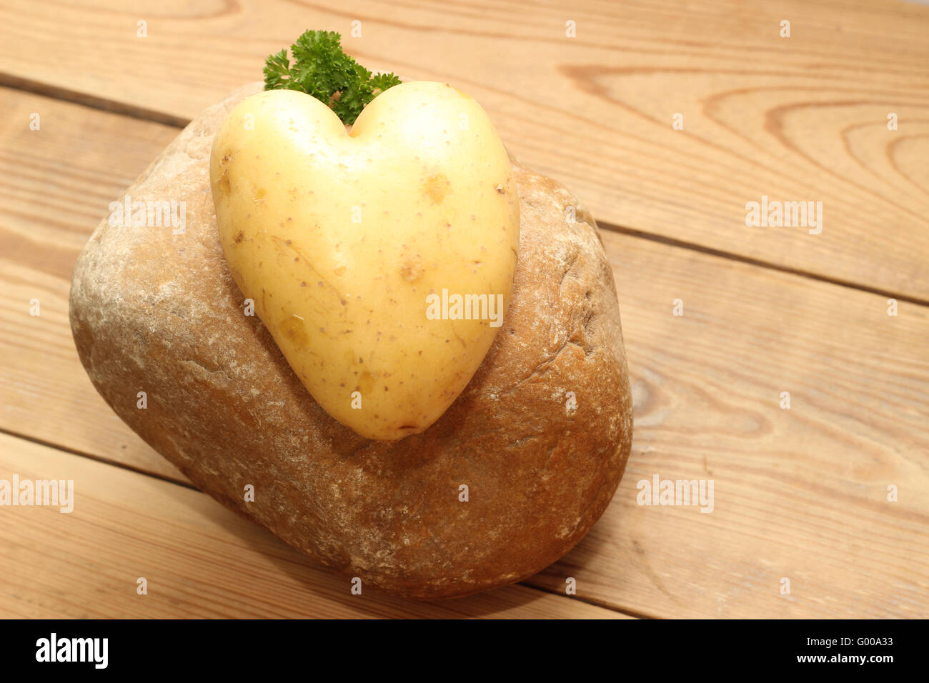 heart potato on stone Stock Photo - Alamy