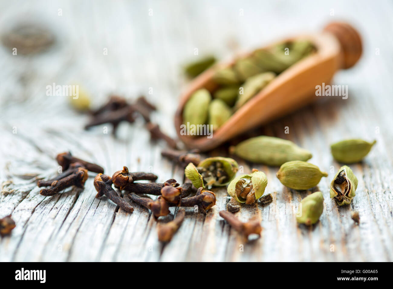 Dry beans cardamom and clove buds Stock Photo - Alamy