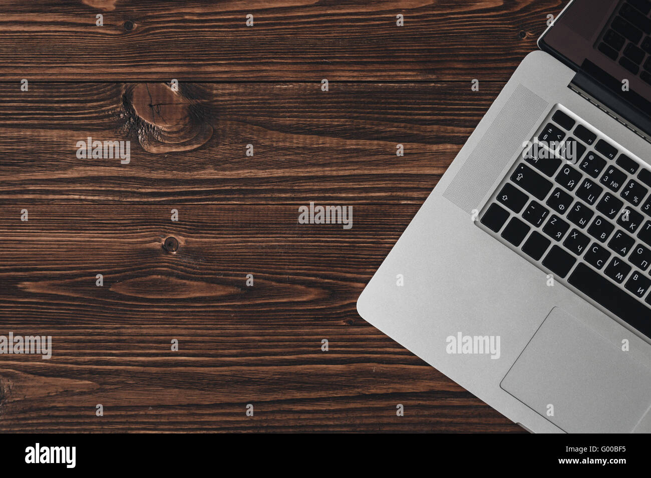 Laptop on the brown wooden desk Stock Photo - Alamy