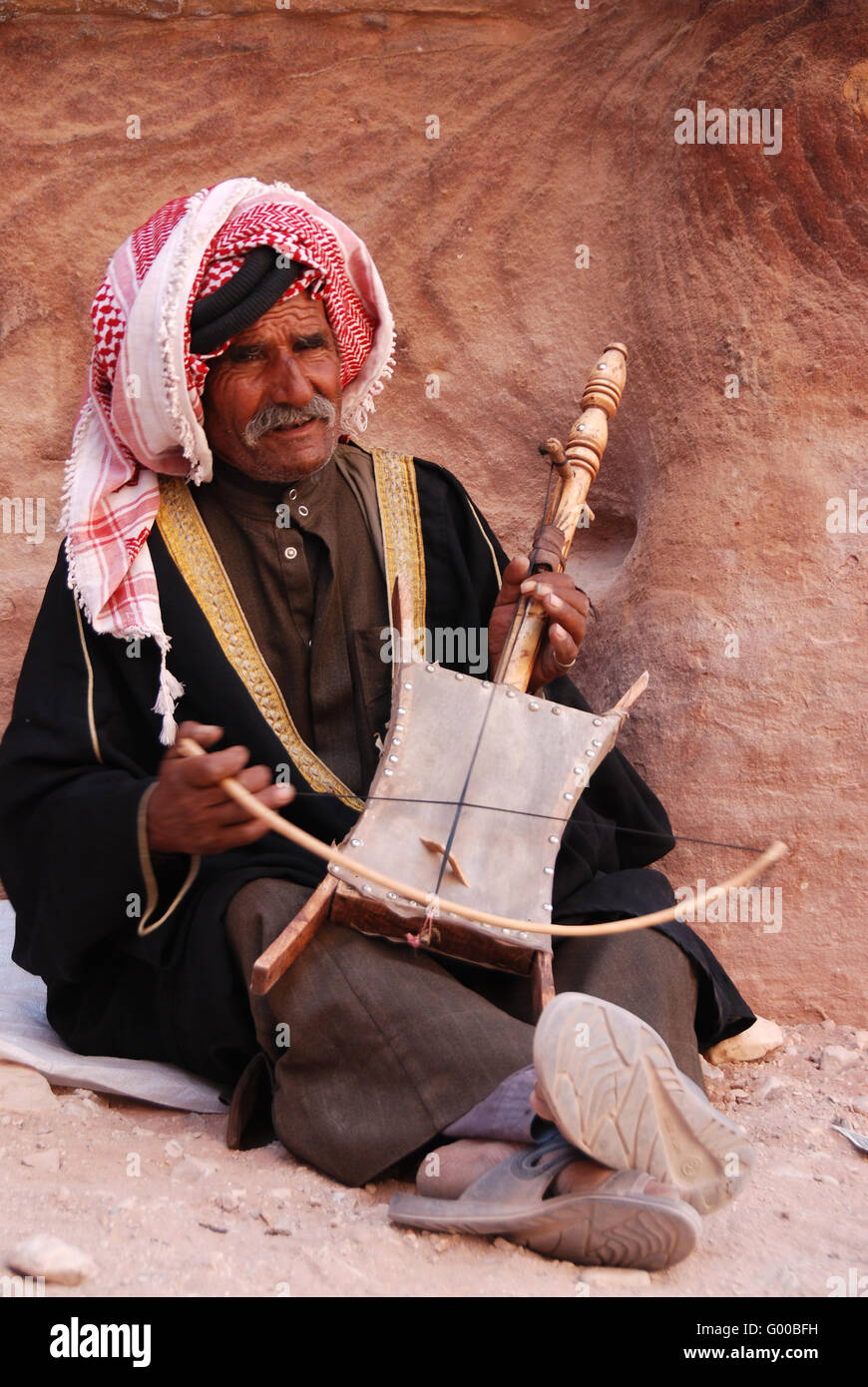 Poor man playing music instrument hi-res stock photography and images ...