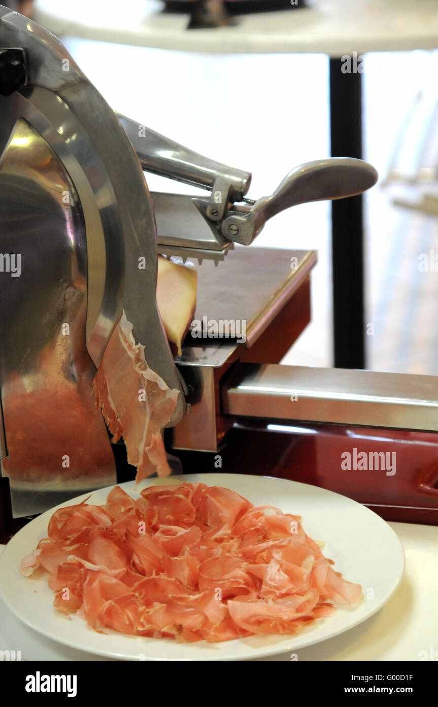 Ham cutting machine with ham Stock Photo - Alamy