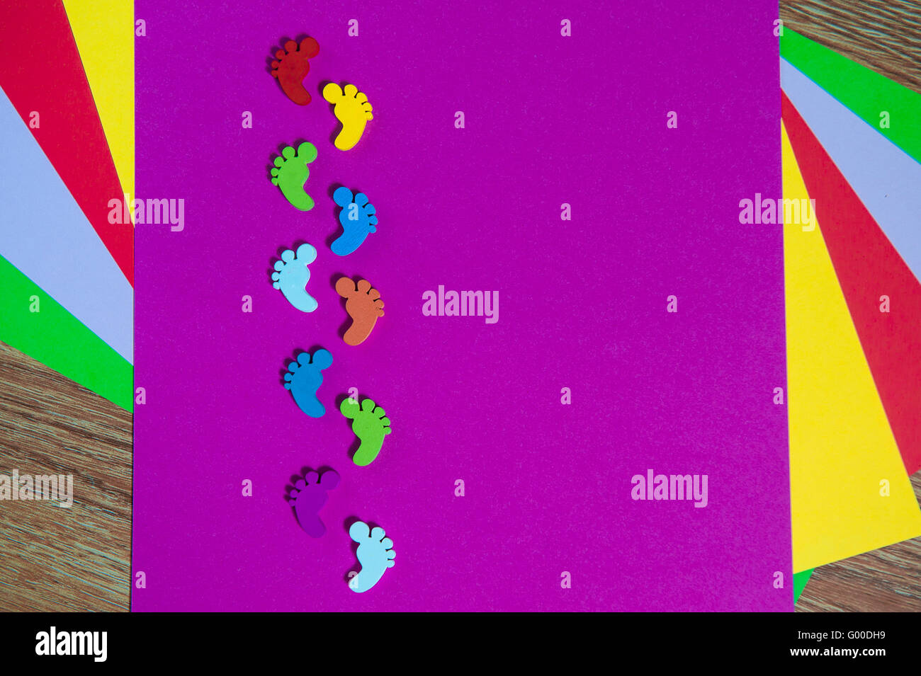 colored sheets of paper, handmade with footprints Stock Photo - Alamy