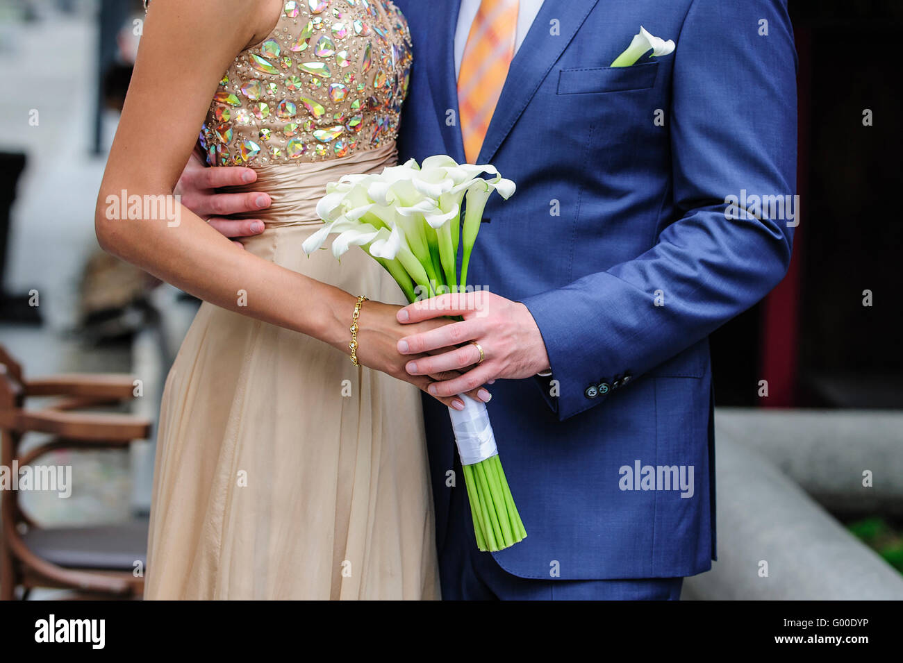 Beautiful newlyweds hold wedding bouquet hi-res stock photography and ...