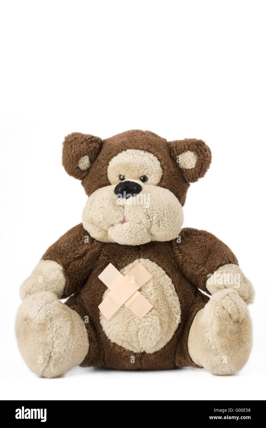 classsical teddy bear with bandaids sitting on a white background Stock ...