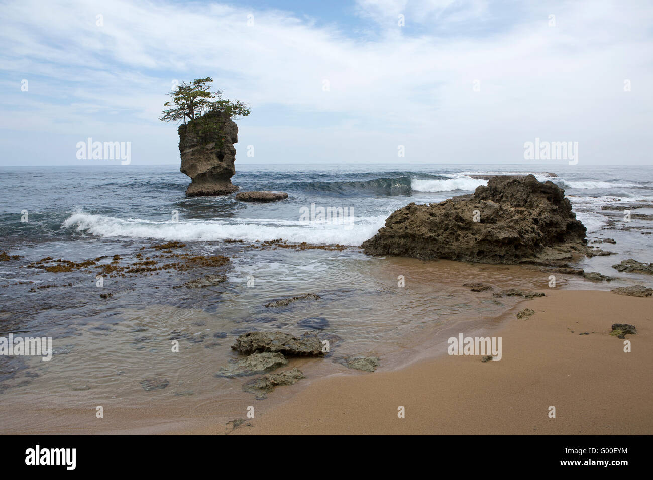Volcanic rock outcrops in the Caribbean Sea off Manzanillo Beach in ...