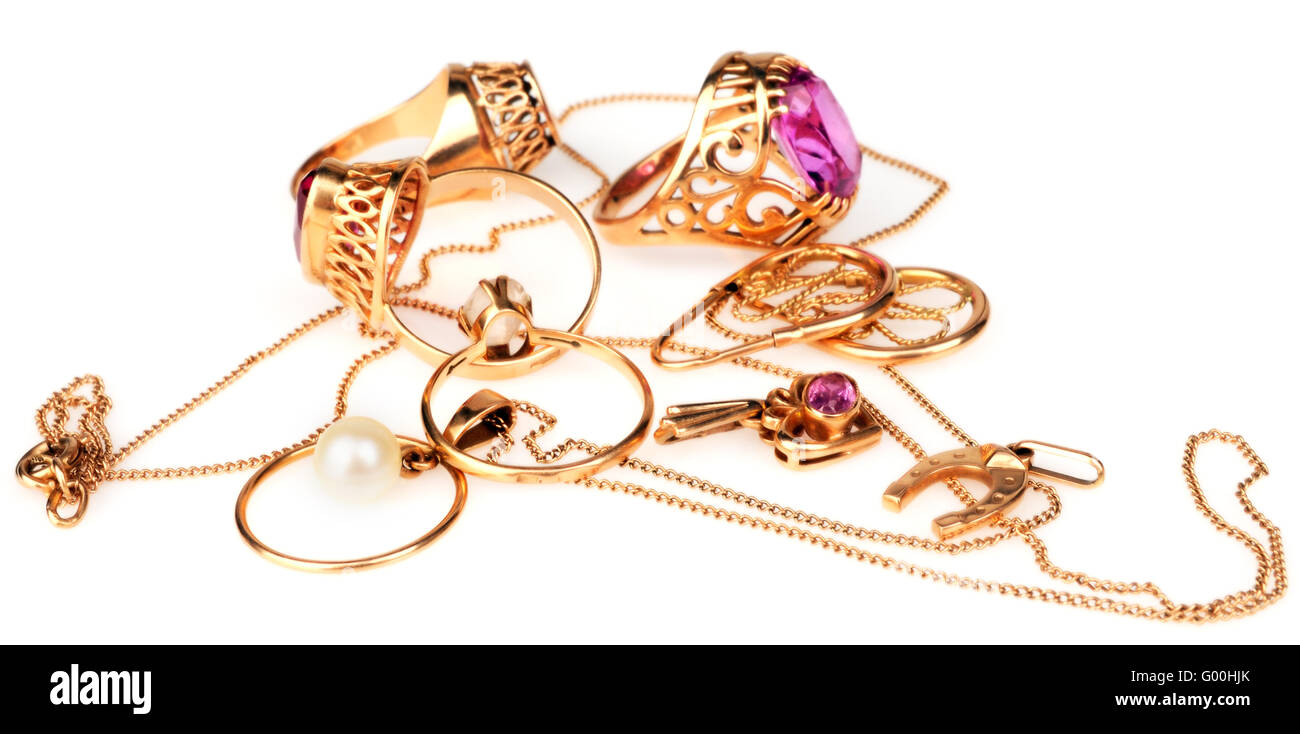 Golden jewelry over white background Stock Photo - Alamy