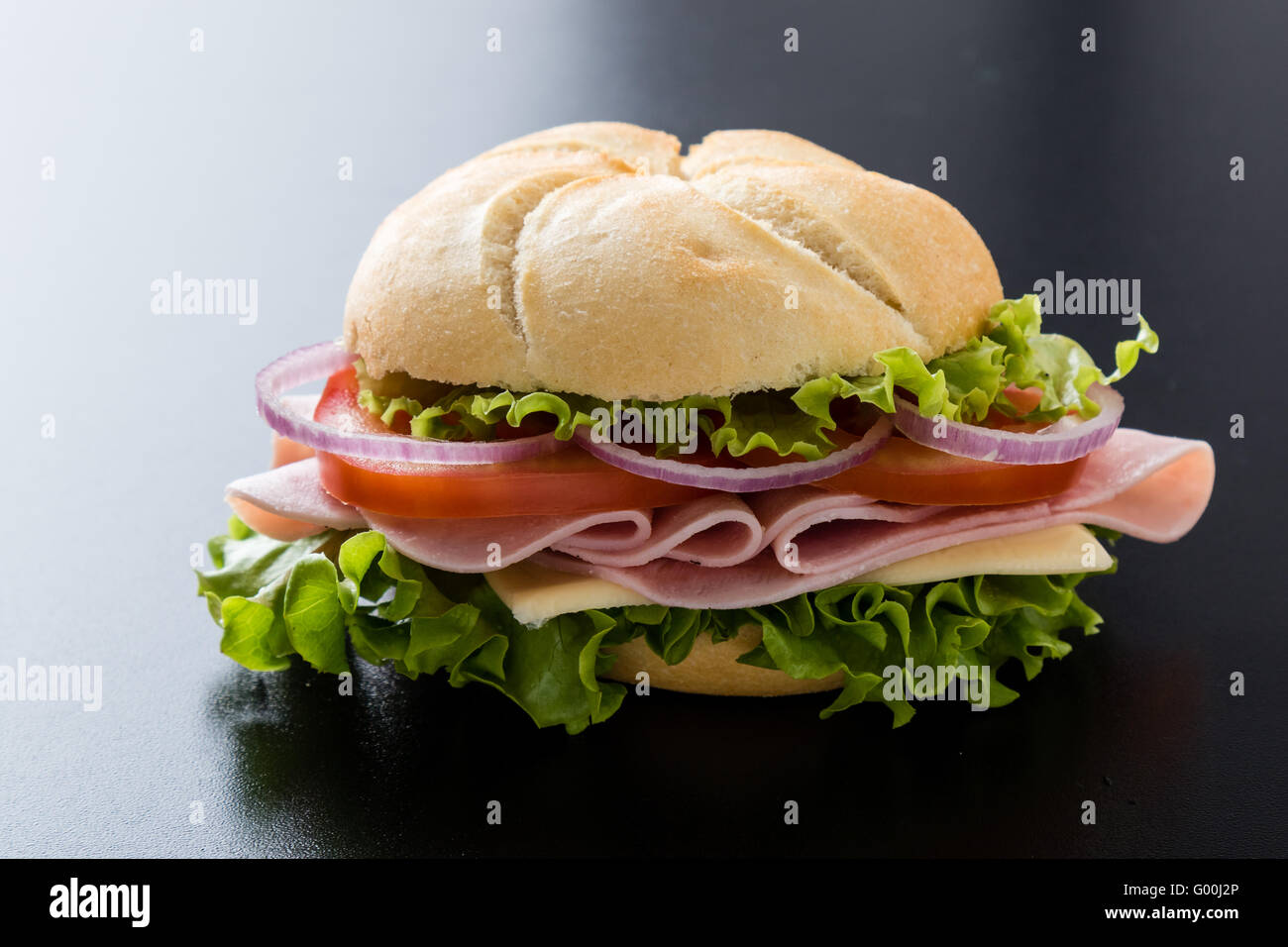 ham sandwich on black table Stock Photo - Alamy