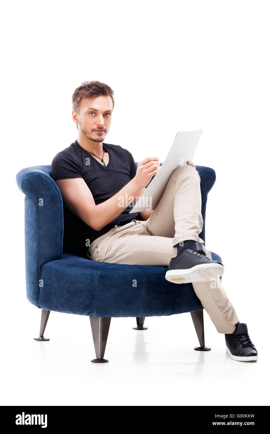 Portrait of a male sitting on chair Stock Photo - Alamy