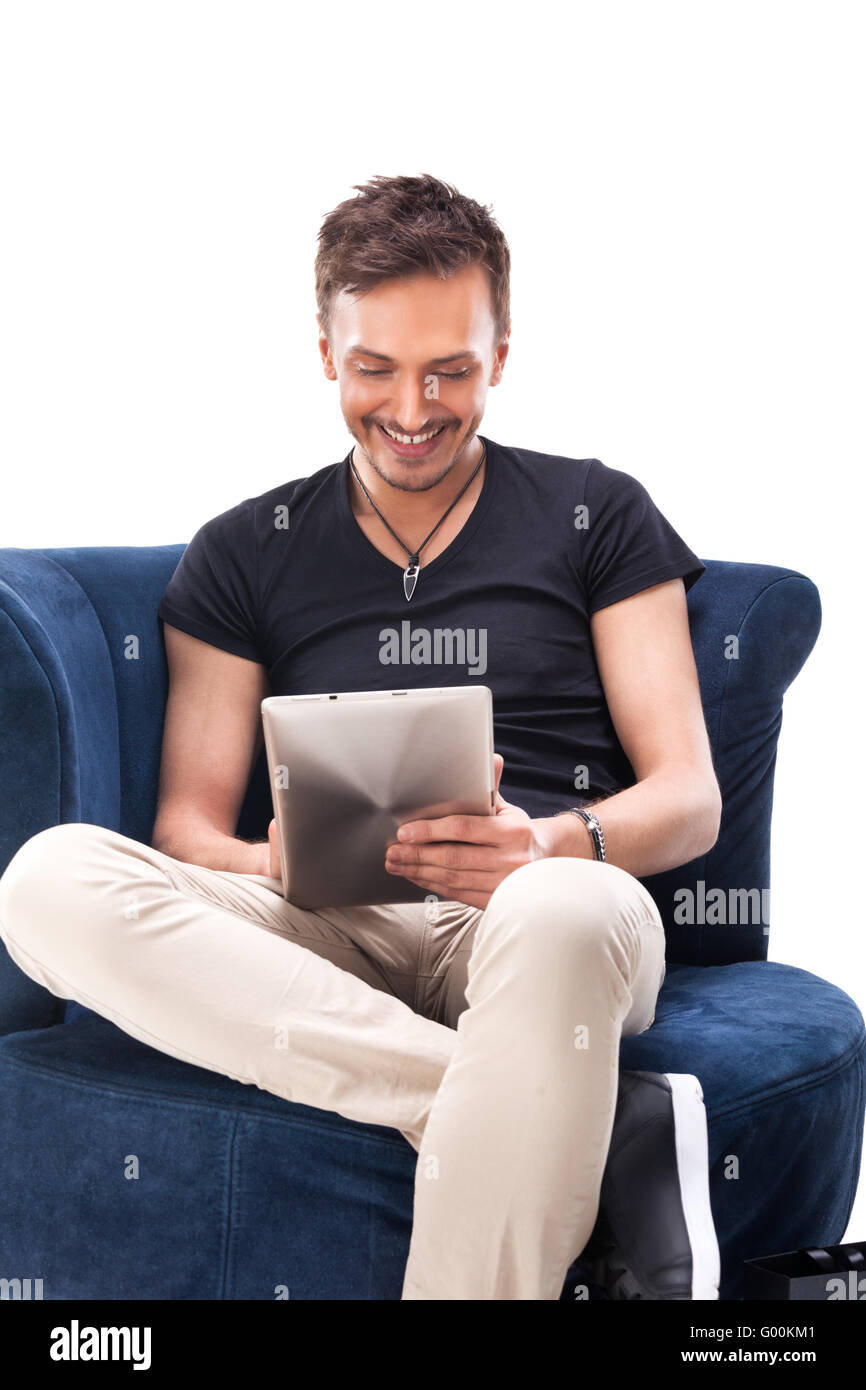 Portrait of a male sitting on chair Stock Photo - Alamy