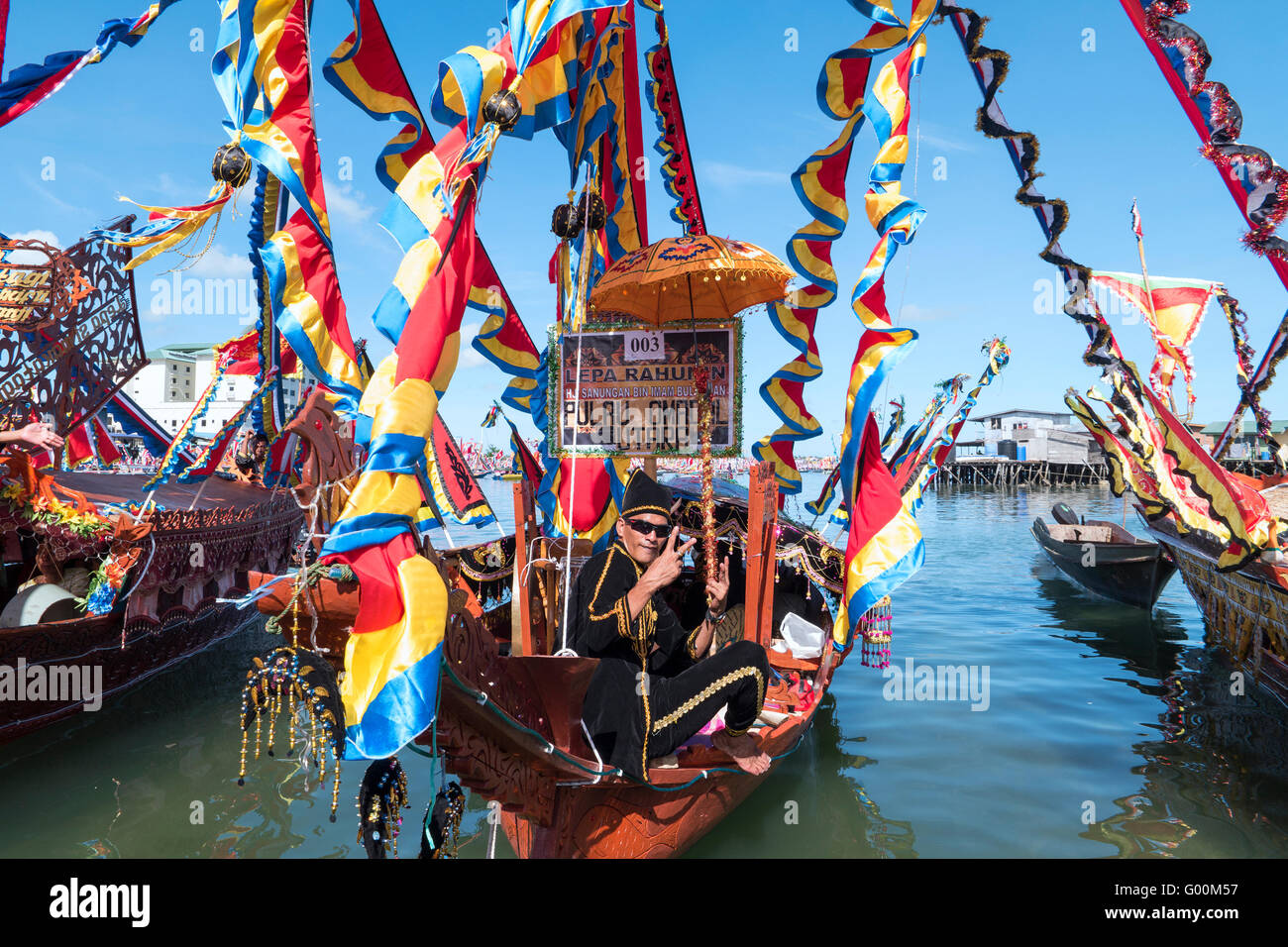 Bajau ethnic pose for camera on traditional boat called Lepa Lepa Stock ...