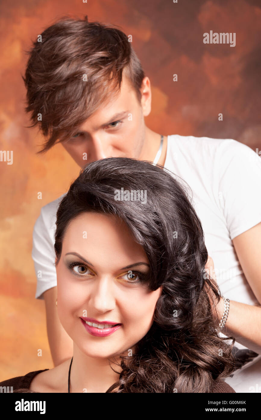 Professional hairdresser with long hair model Stock Photo - Alamy