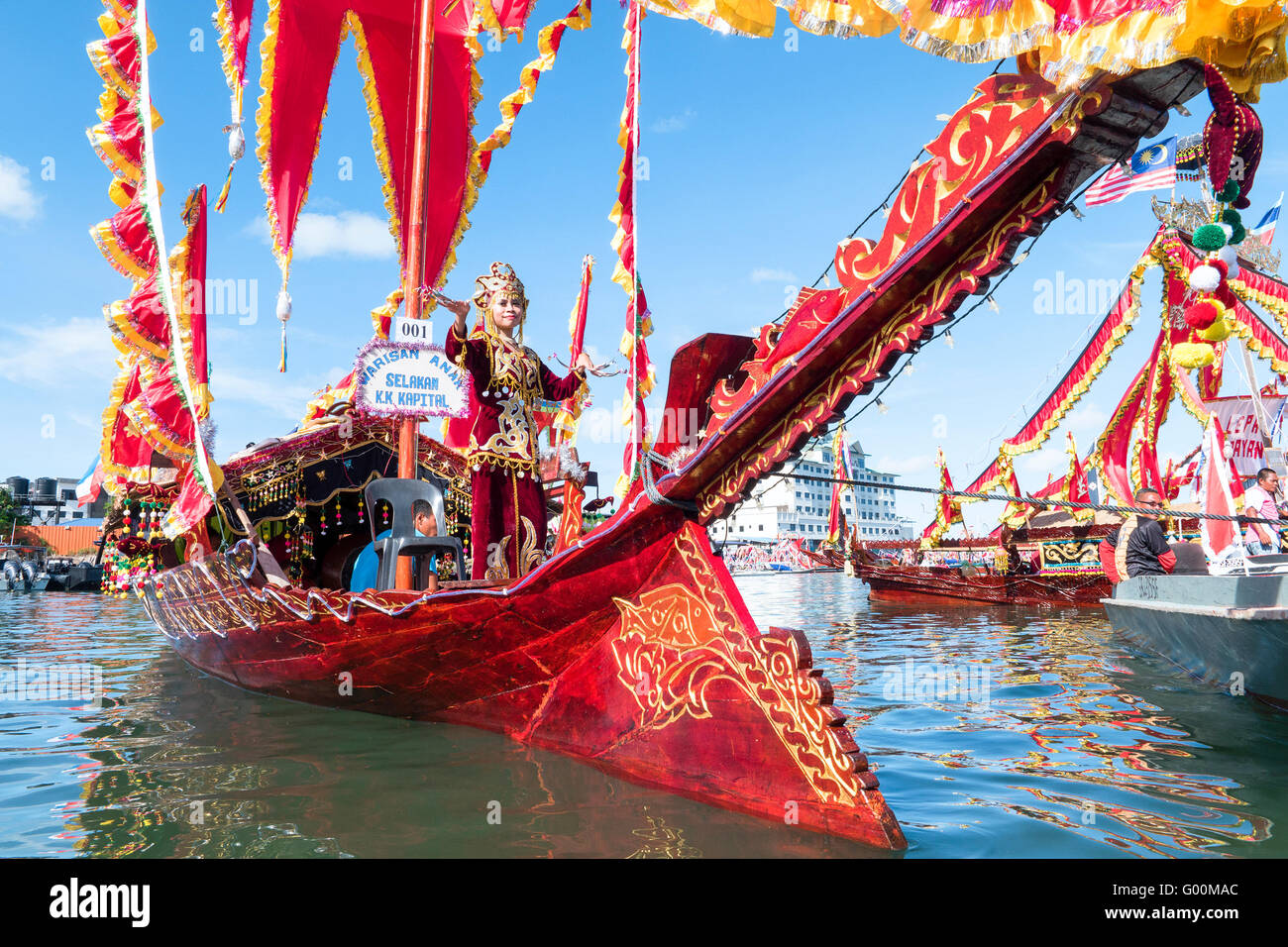 Bajau lady dancing on traditional boat called Lepa Lepa decorated with ...