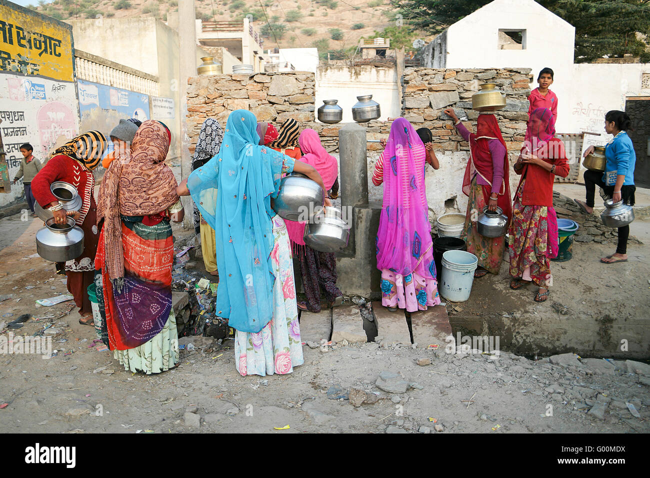 local indian women waiting thier turn to collecting water as daily ...