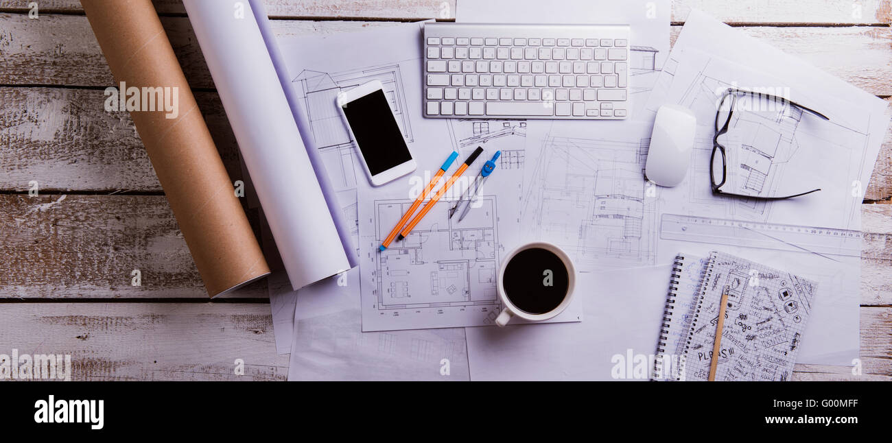 Desk with gadgets and office supplies. Computer keyboard, smart phone ...