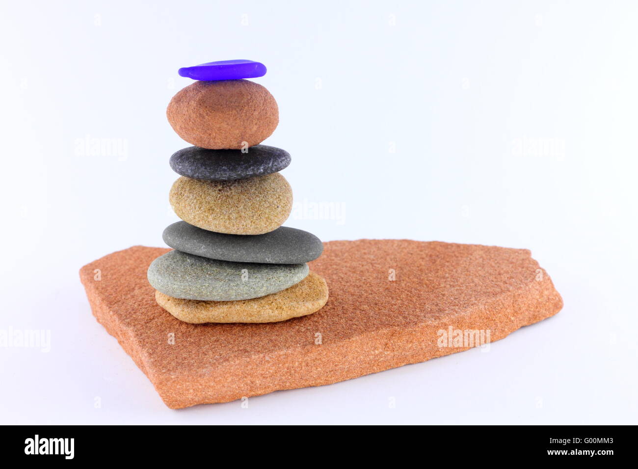 Sea pebbles balanced on top of each other Stock Photo - Alamy