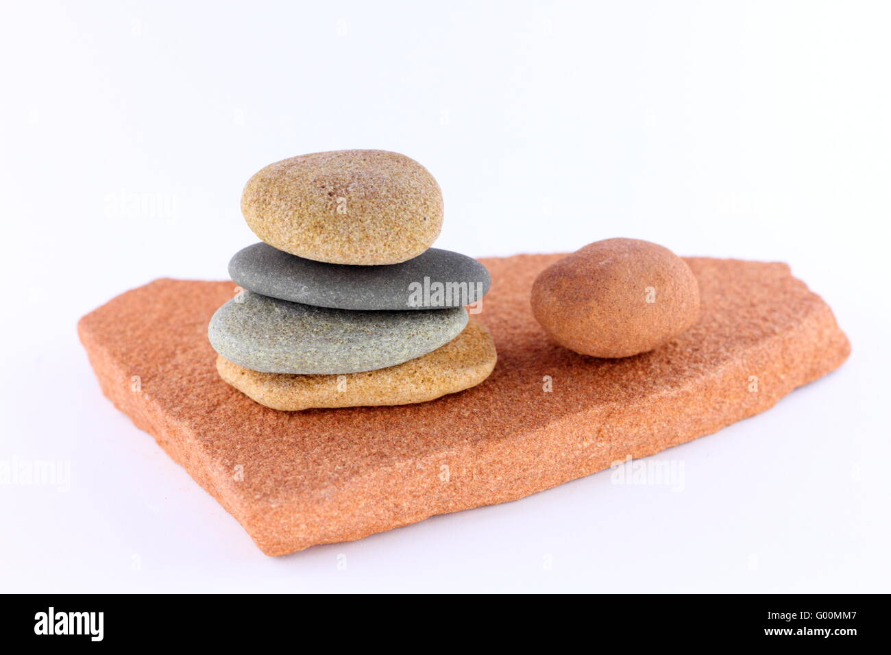 Sea pebbles balanced on top of each other Stock Photo - Alamy