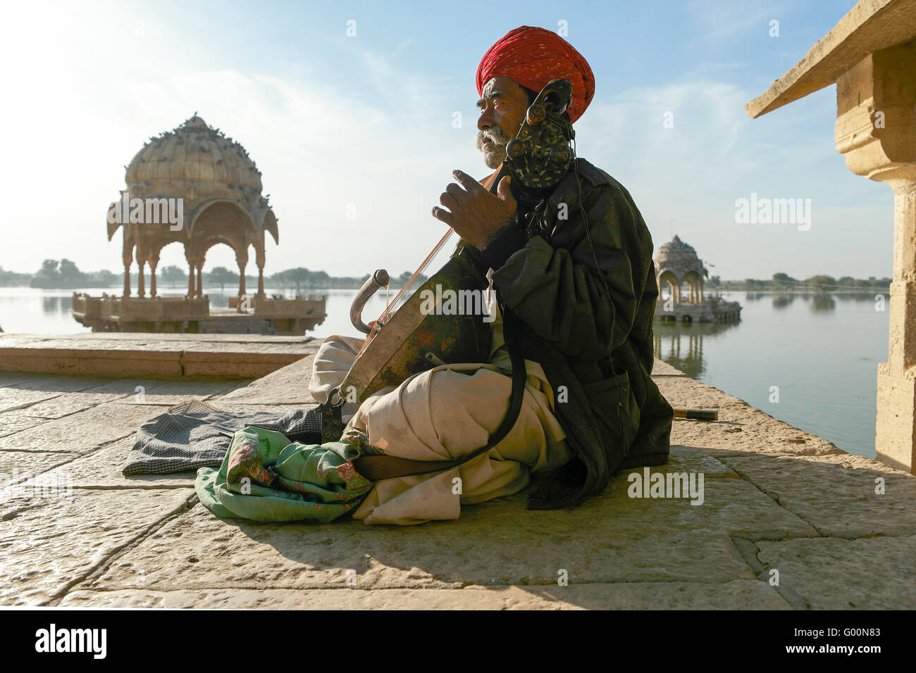 nomads plays kamaycha in the Ghadisar Lake in Jaisalmer, India Stock ...