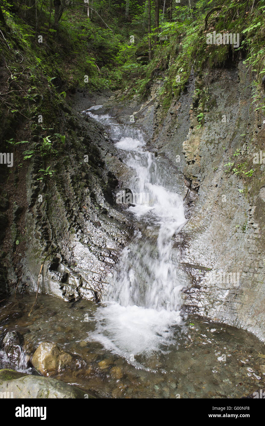 water stream flowing down from the mountain Stock Photo - Alamy