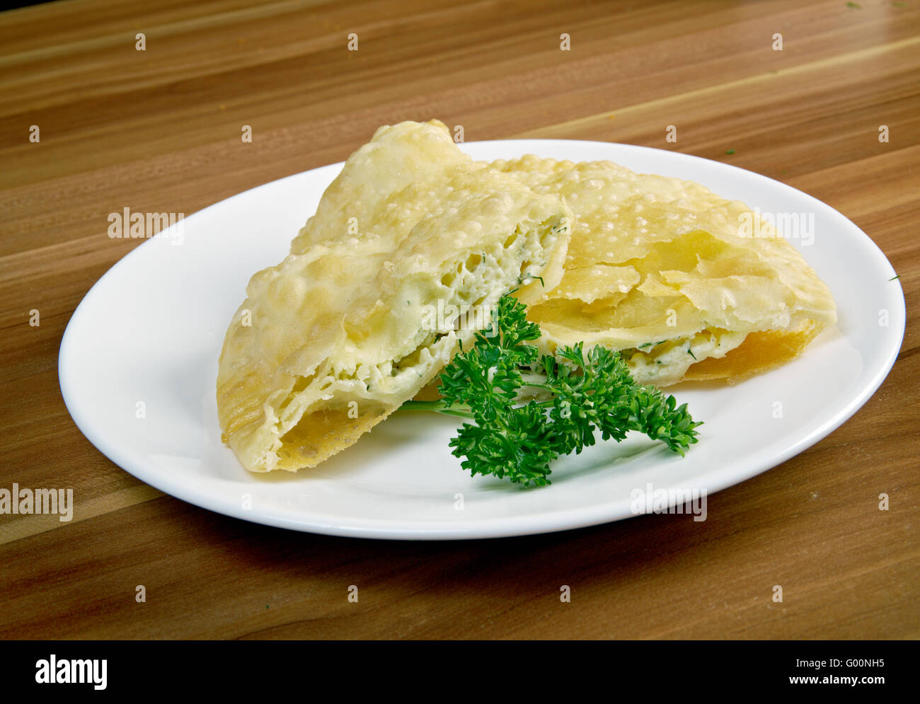 Cheburek with cheese Stock Photo - Alamy