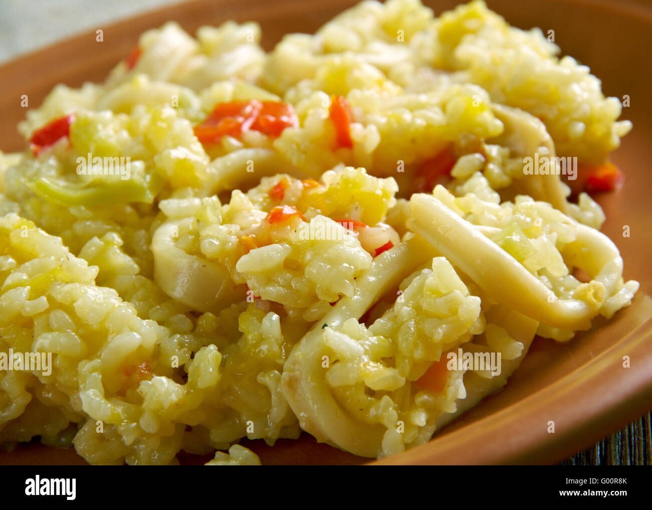 Paella with squid Stock Photo - Alamy