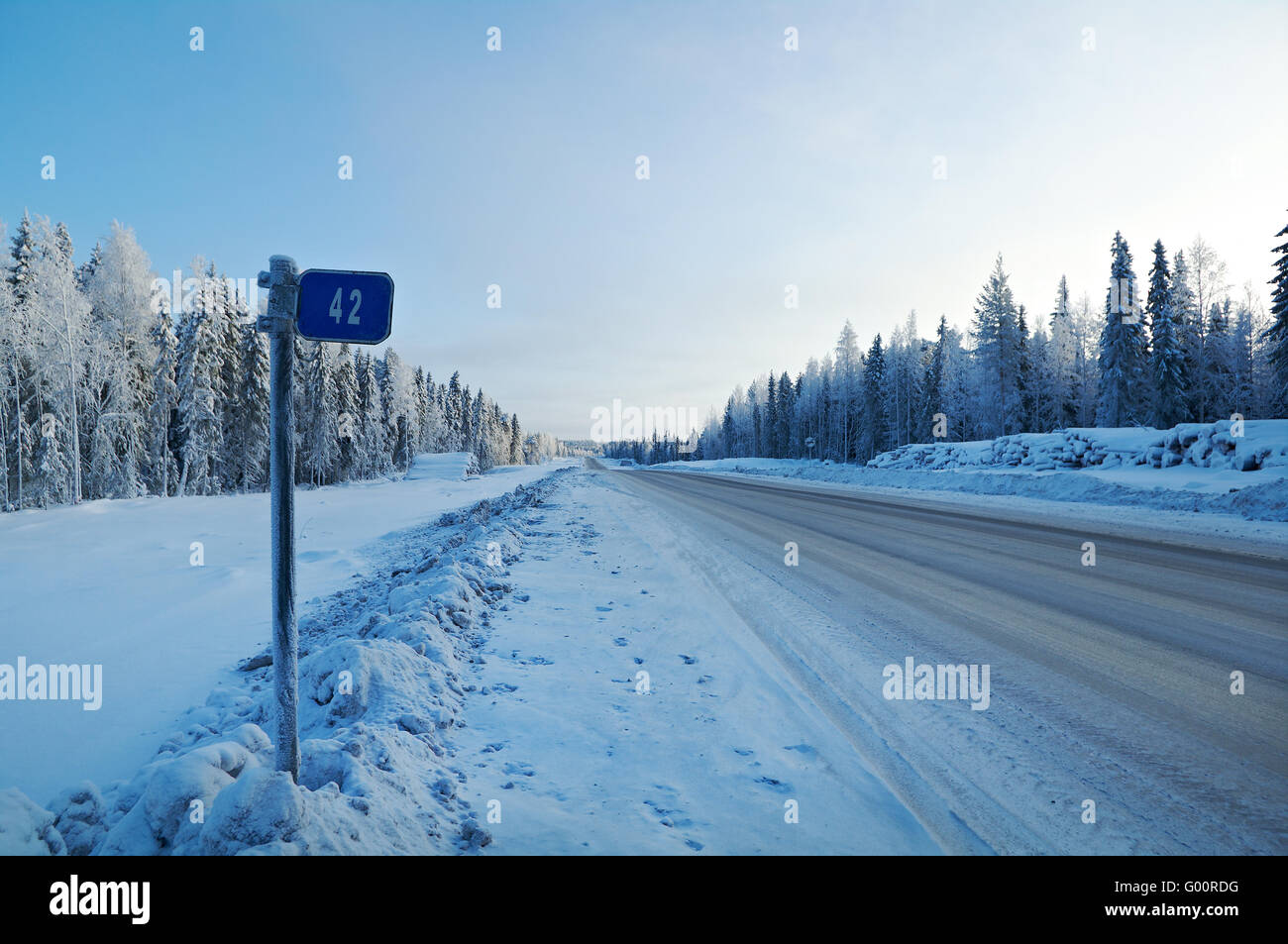Deep snowy forest road hi-res stock photography and images - Alamy