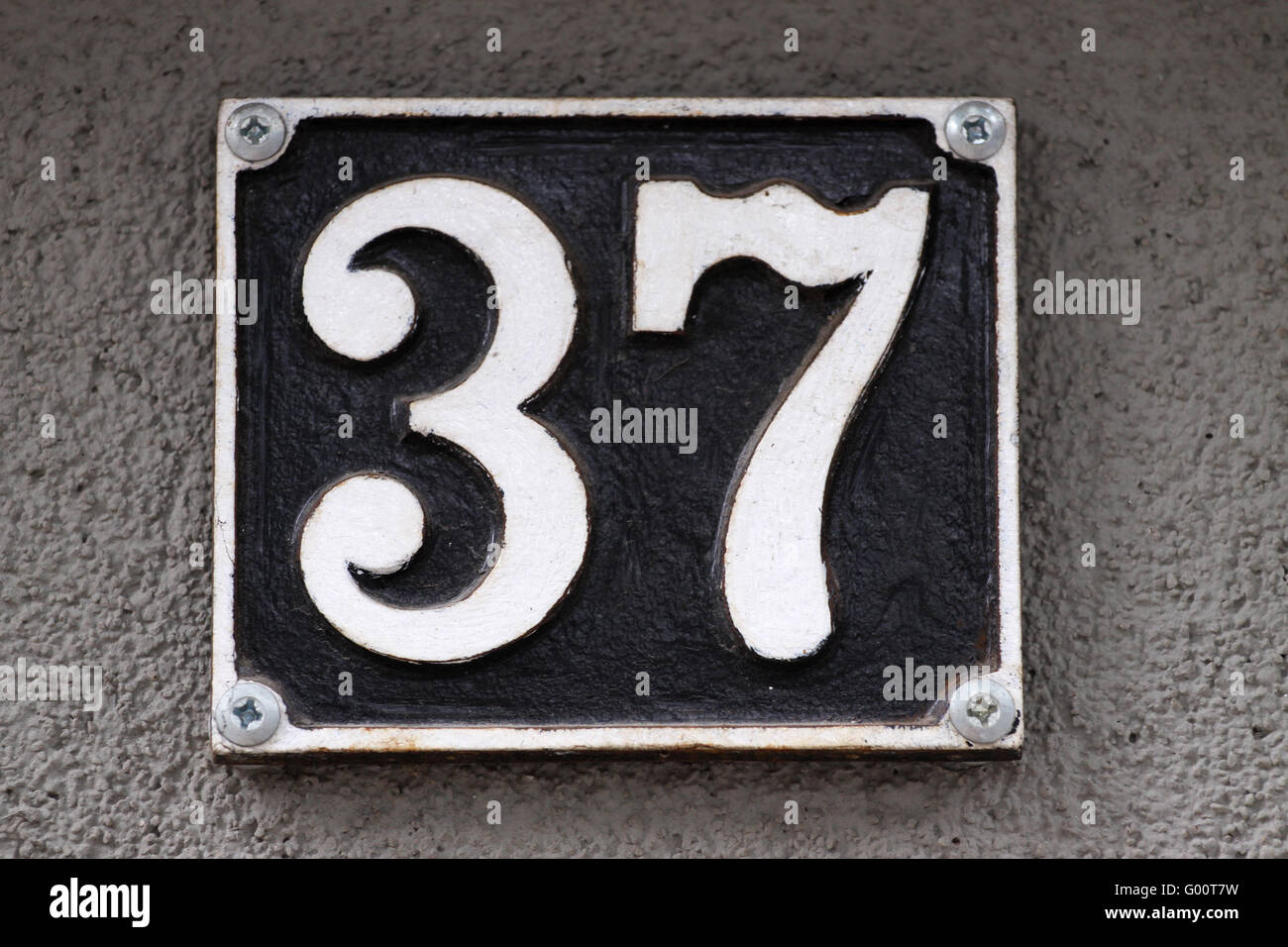 House number on a wall Stock Photo - Alamy