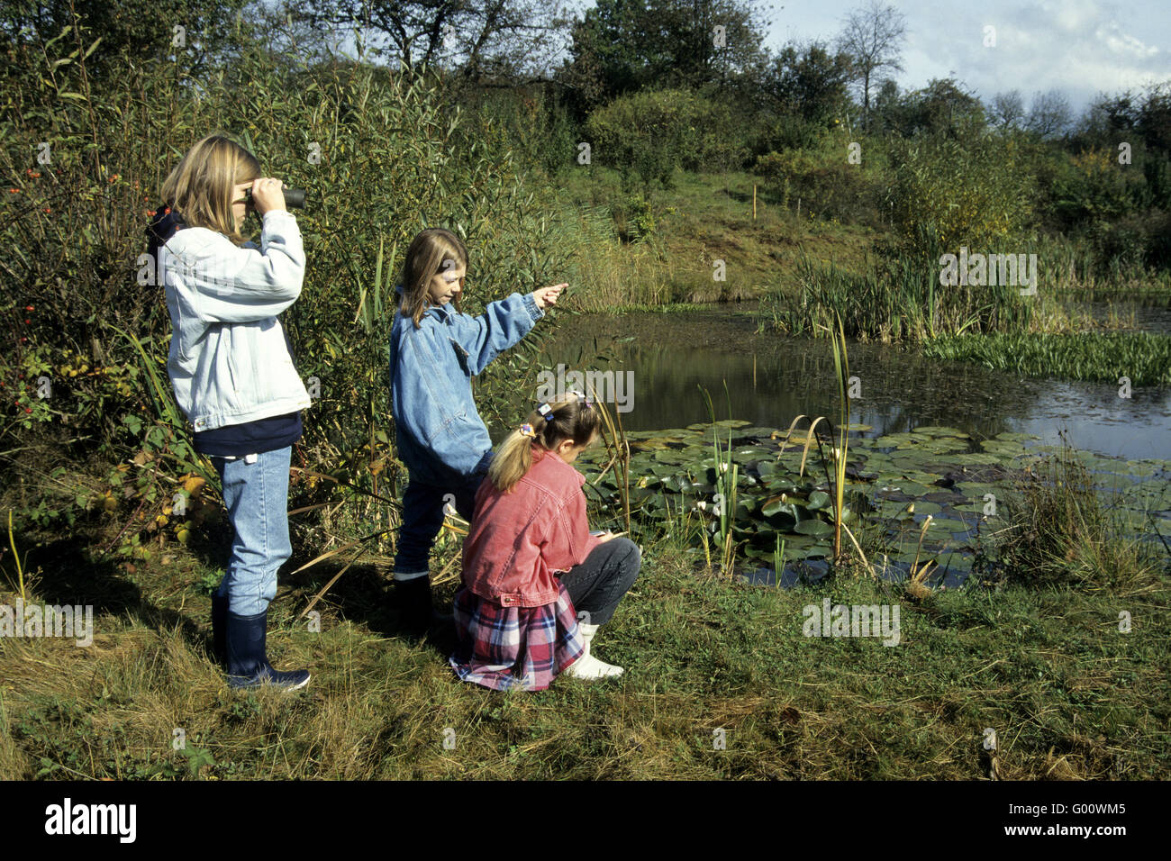 Group children playing pond hi-res stock photography and images - Alamy