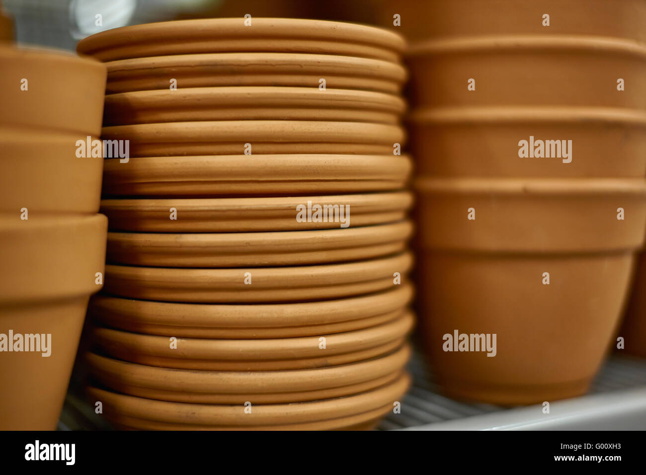 Stack of Clay Trays for clay pots with shallow depth of field Stock ...