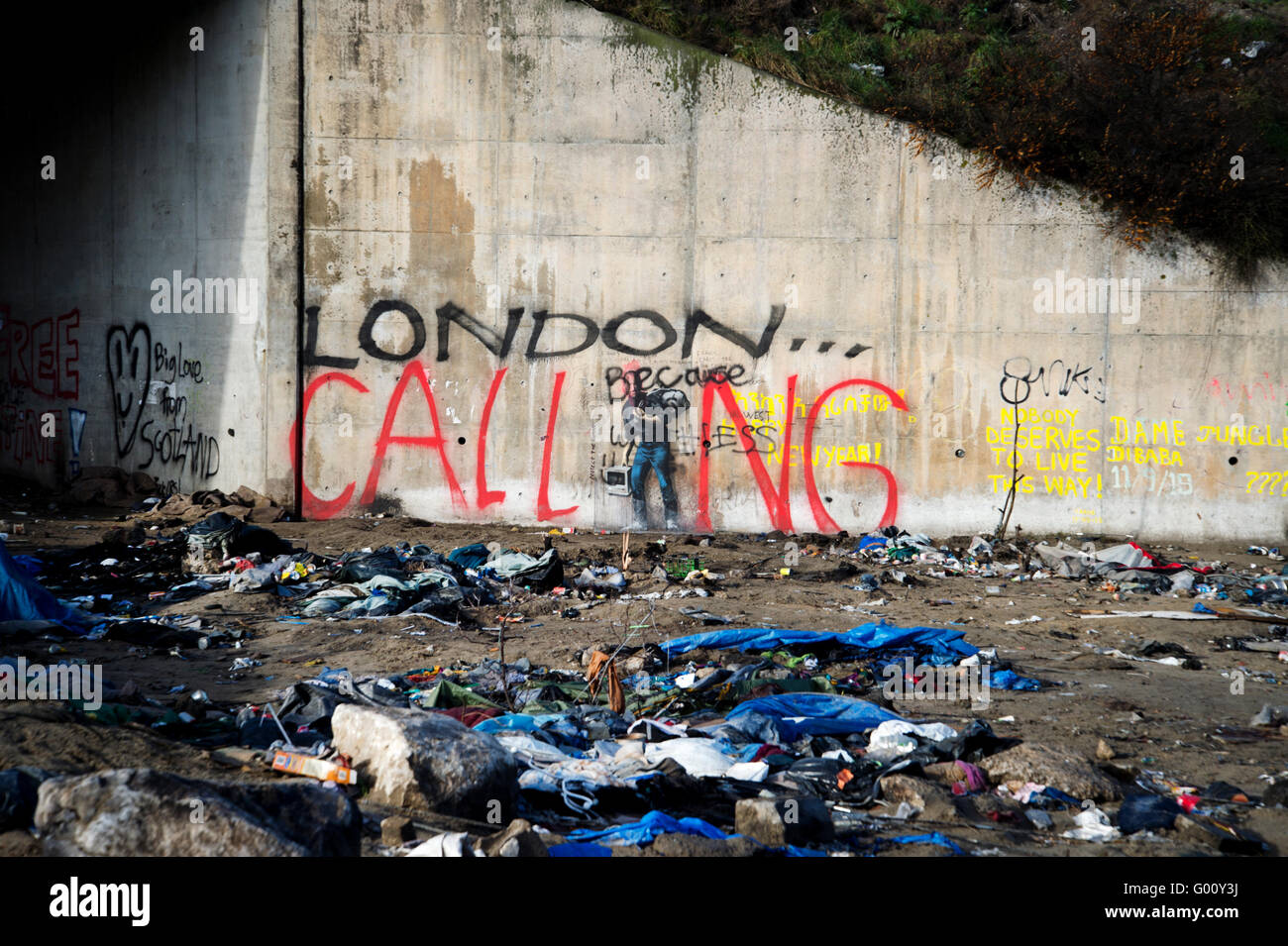 France, Calais. 'Jungle' camp for refugees. Motorway viaduct with ...