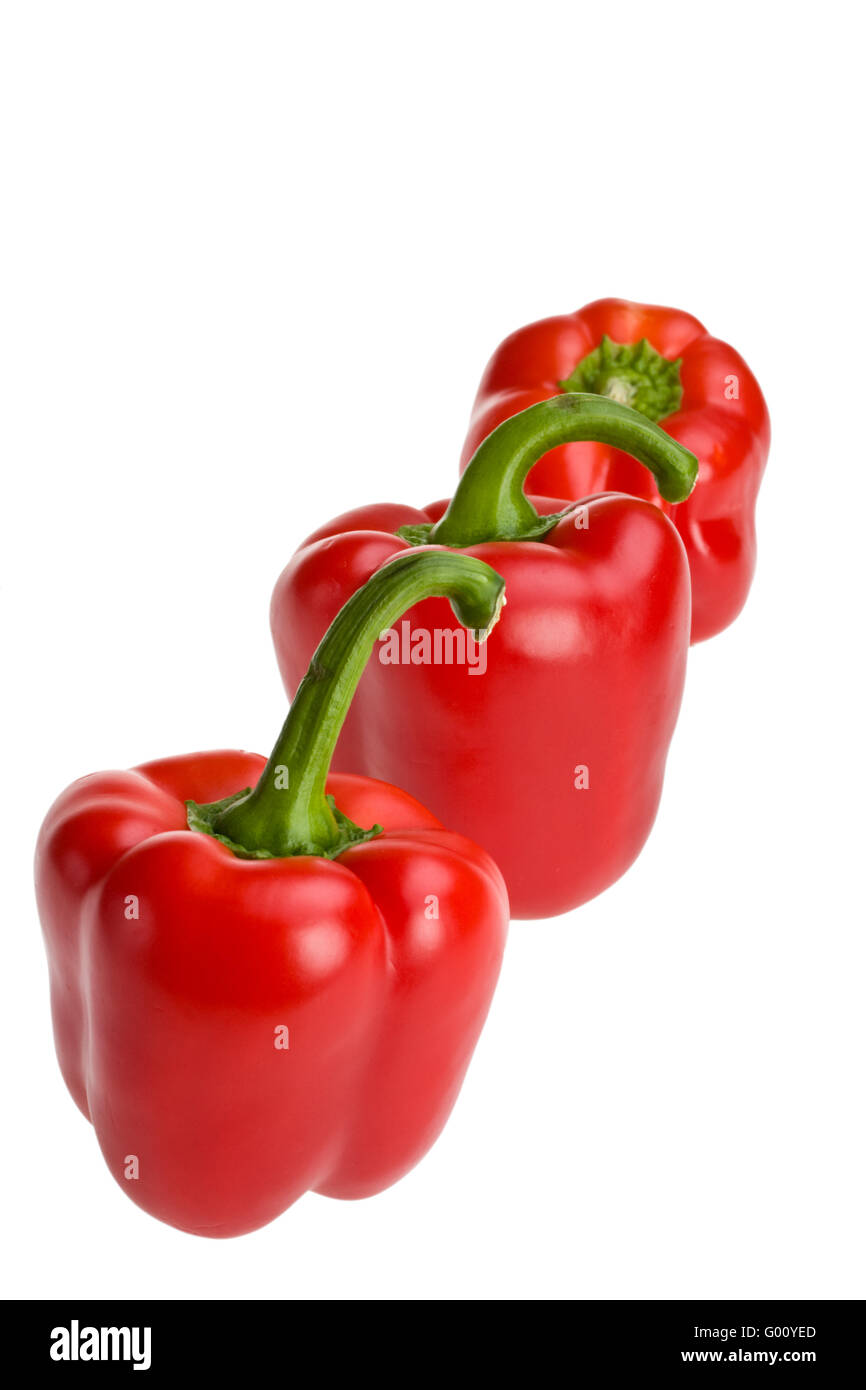 three red bell pepper s in a row isolated on white Stock Photo - Alamy