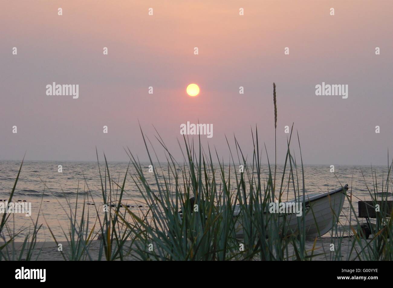 Idyllic beach at sunset Stock Photo - Alamy