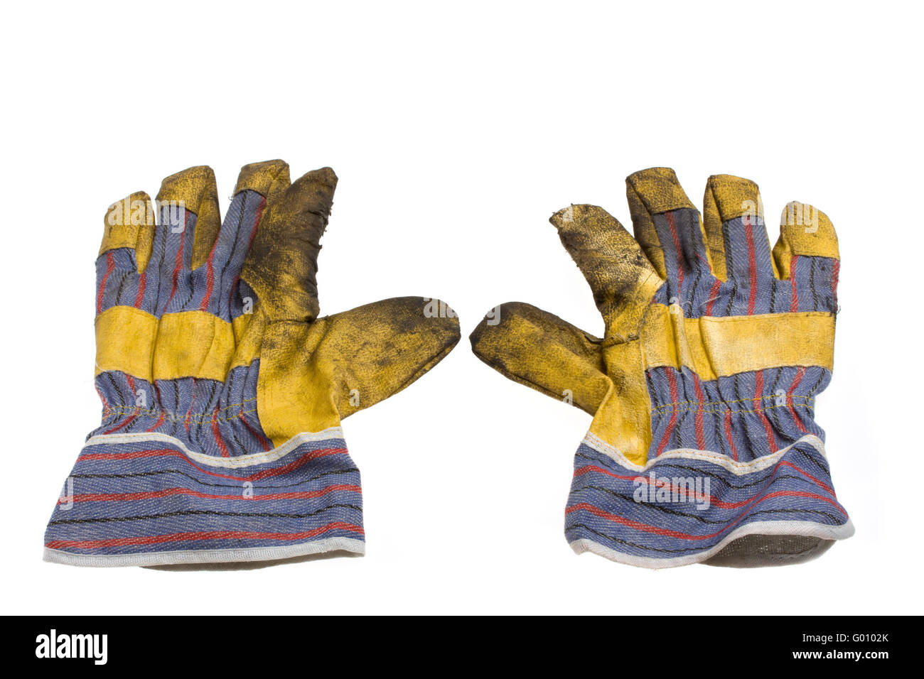a pair of dirty used work gloves isolated on white background Stock ...