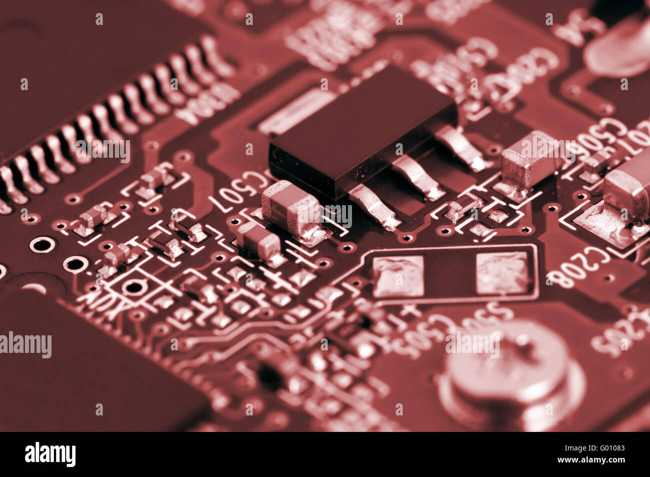 Details of electronic circuit board in red tone Stock Photo - Alamy