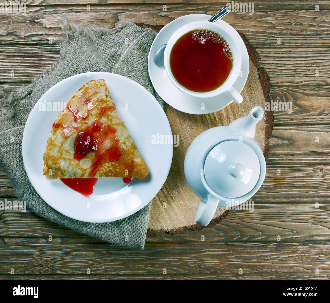 The traditional Russian breakfast - Homemade crepes with jam and tea ...